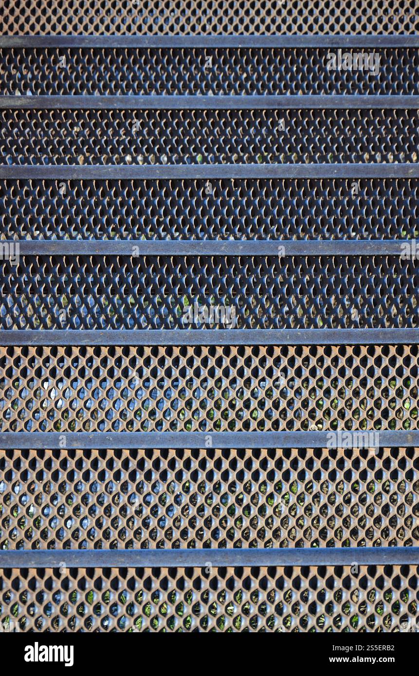 Texture steps of rusty metal mesh in the sections of the metal strips ...