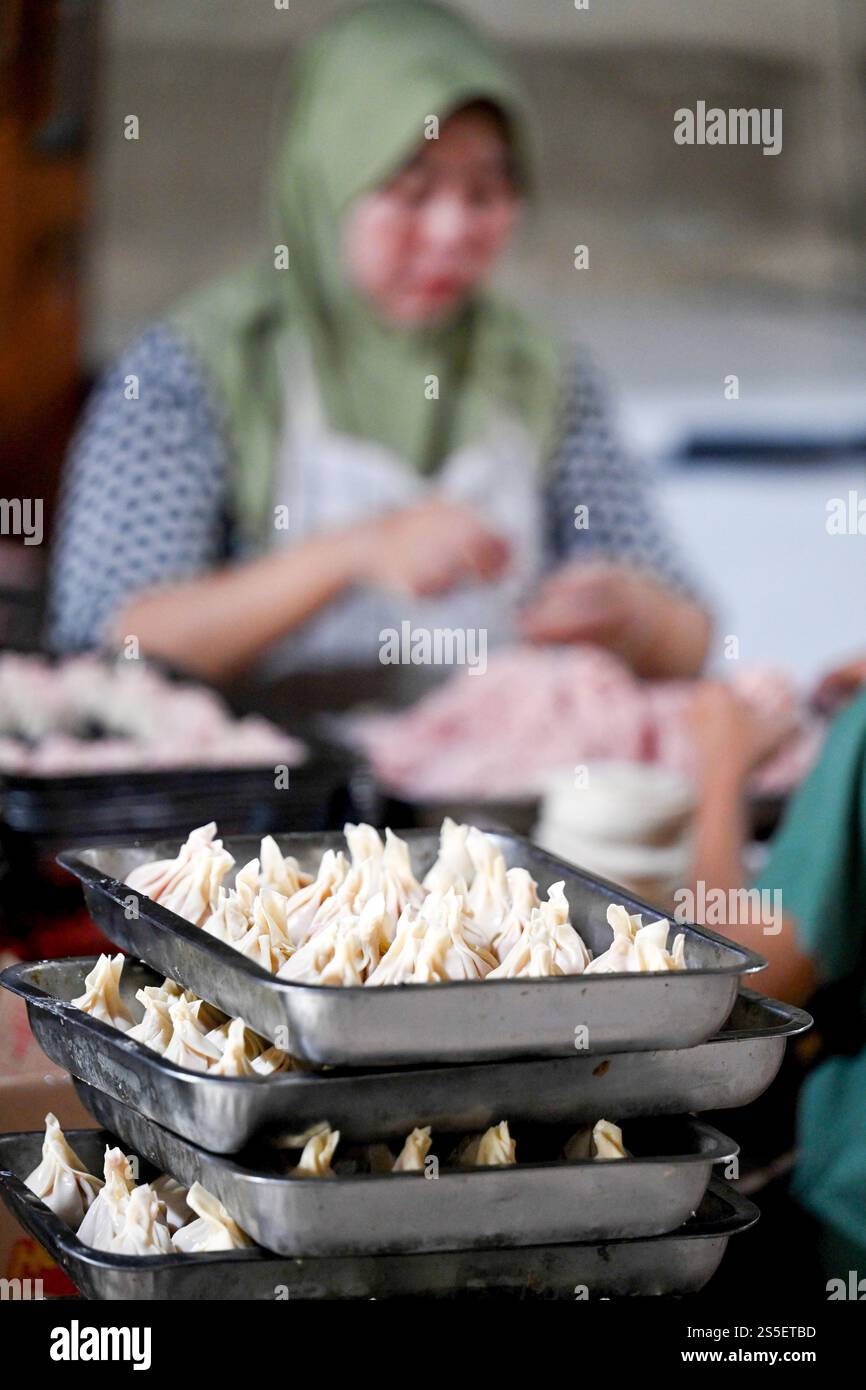 South Tangerang, Indonesia. 14th Jan, 2025. A worker makes dim sum at a workshop in South ...