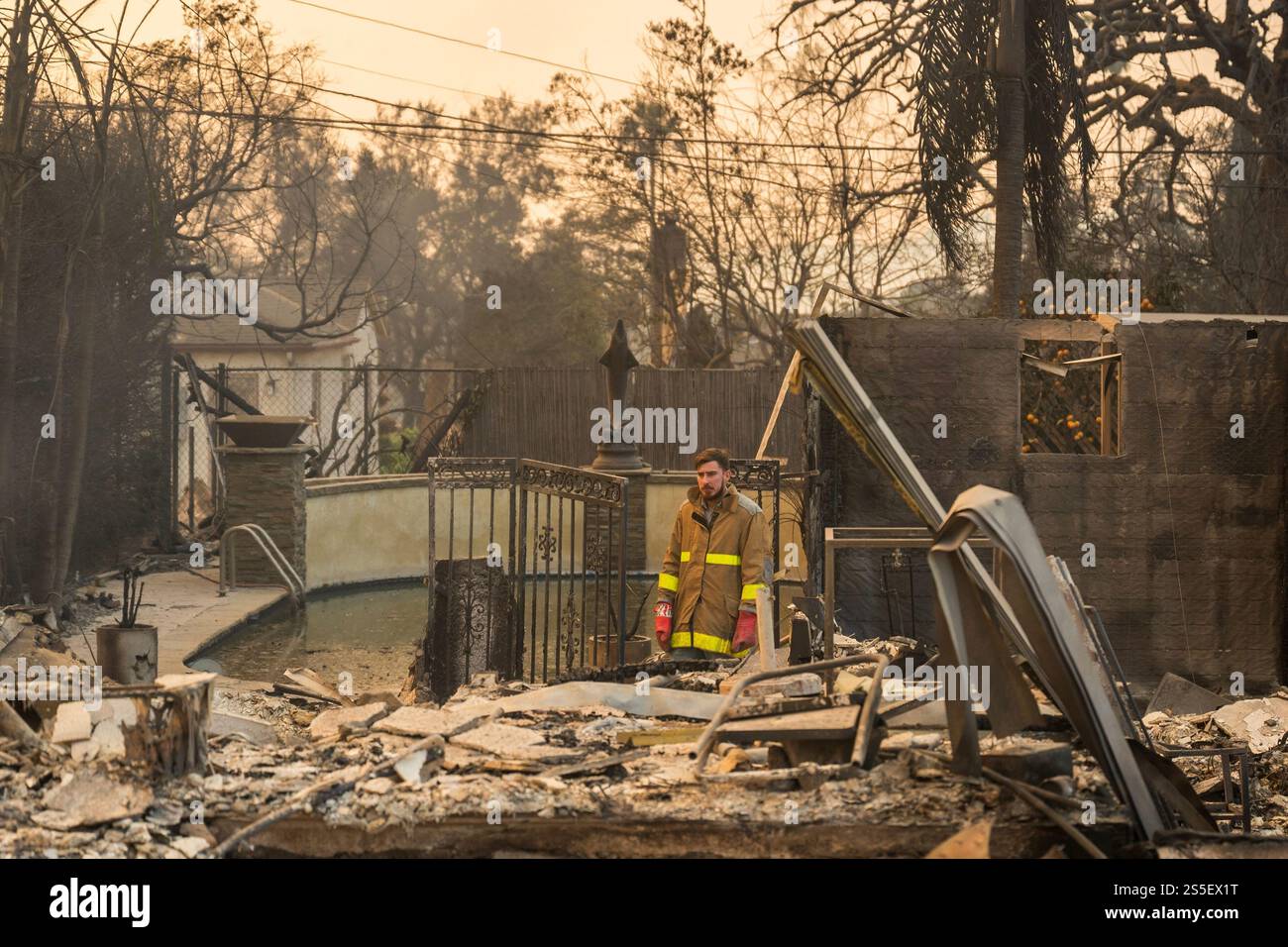 Robert Lara looks through his home that was destroyed after the Eaton ...
