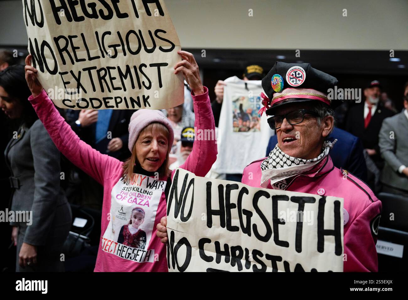 Members of the protest group Code Pink protest Pete Hegseth, President ...