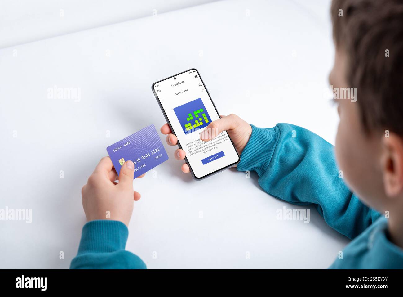Boy purchasing a mobile game on a smartphone, illustrating the concept ...