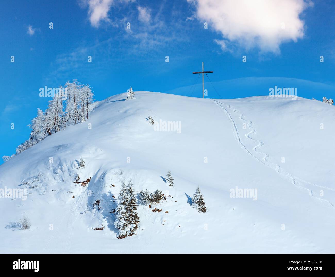 Winter snowy hill with cross on top Stock Photo - Alamy