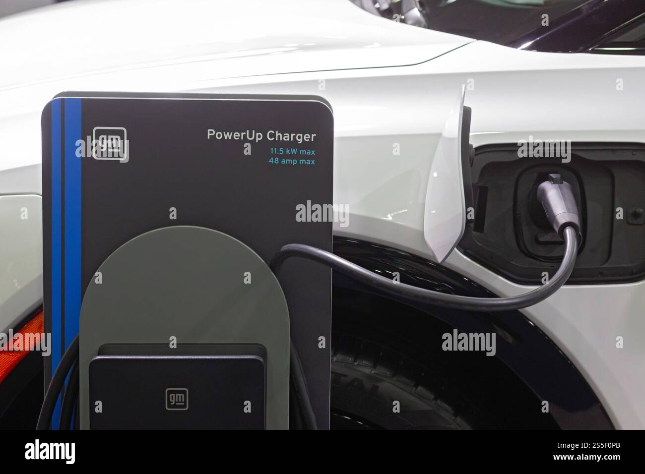 Detroit, Michigan, USA. 10th Jan, 2025. An electric vehicle plugged ...