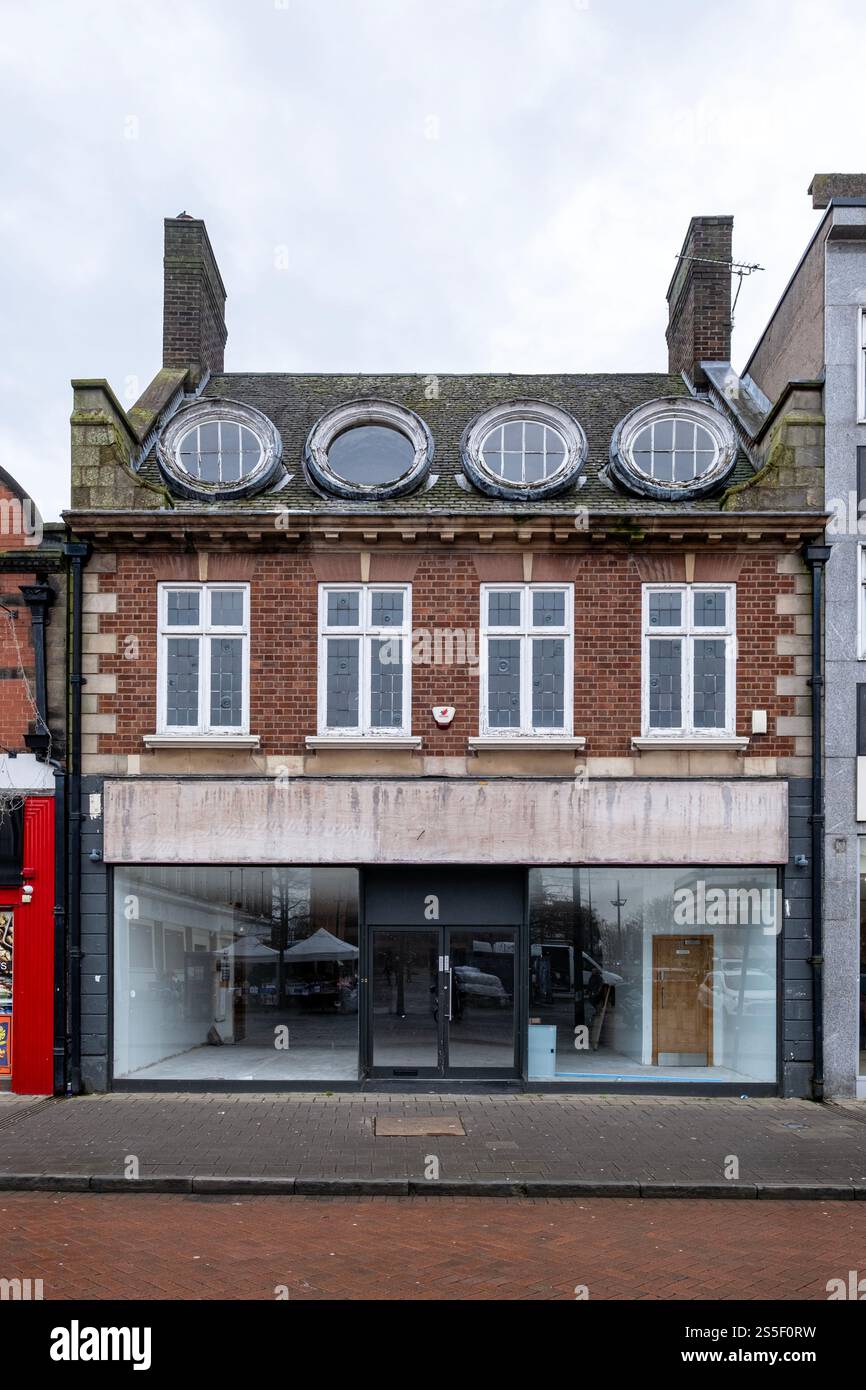Closed down shop, with removed shop signs, in town centre of Crewe ...