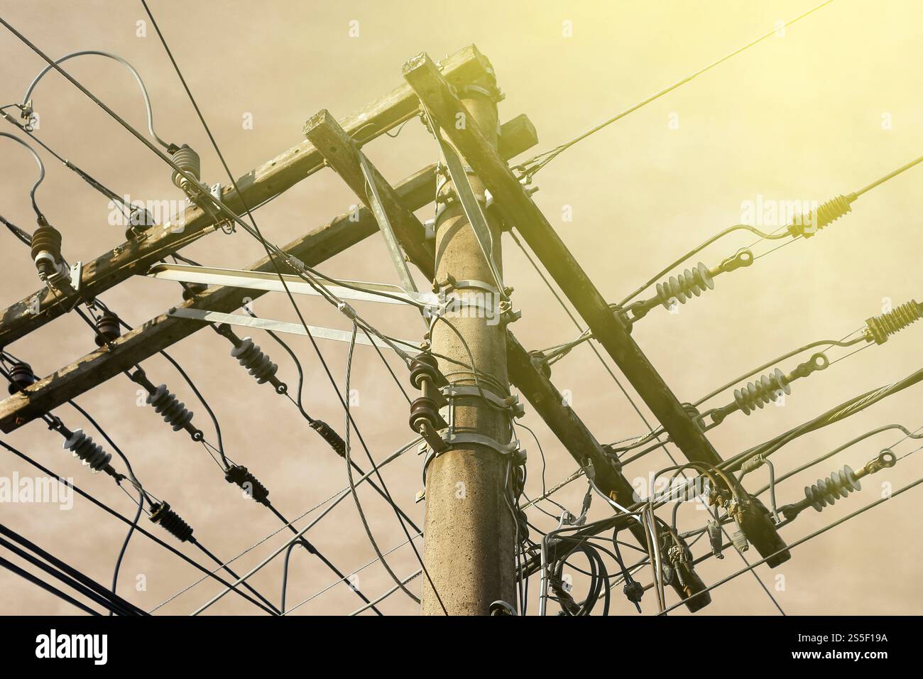concrete pole with electrical power, telephony and fiber optic cabling ...