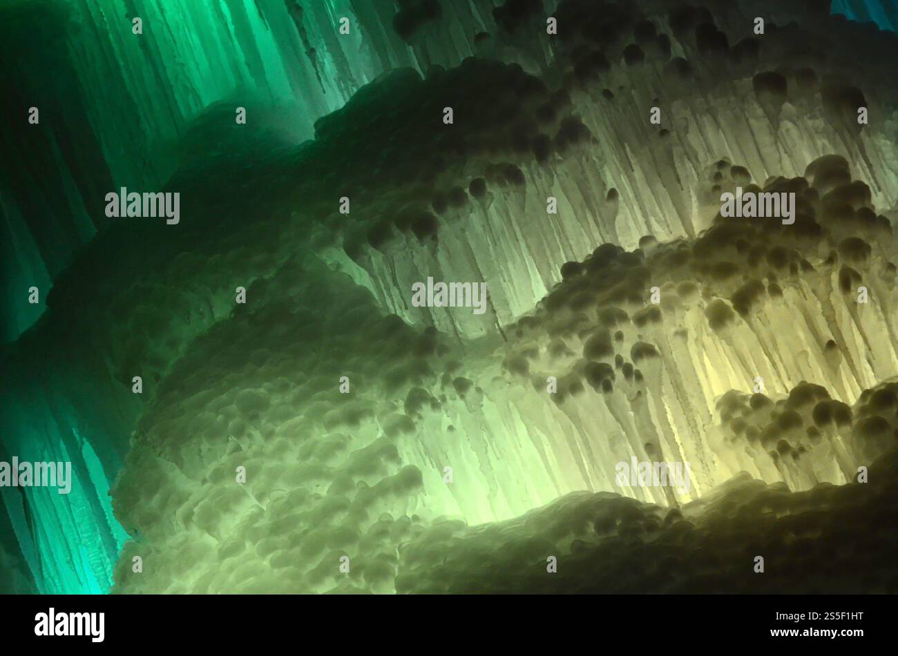 Huge ice icicles. Fragment of large blocks of ice frozen waterfall of ...