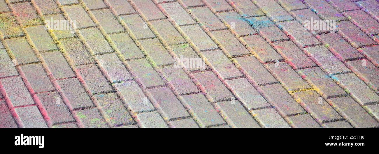 Multi colored earth, paving slabs, powder coated with dry colors at the ...