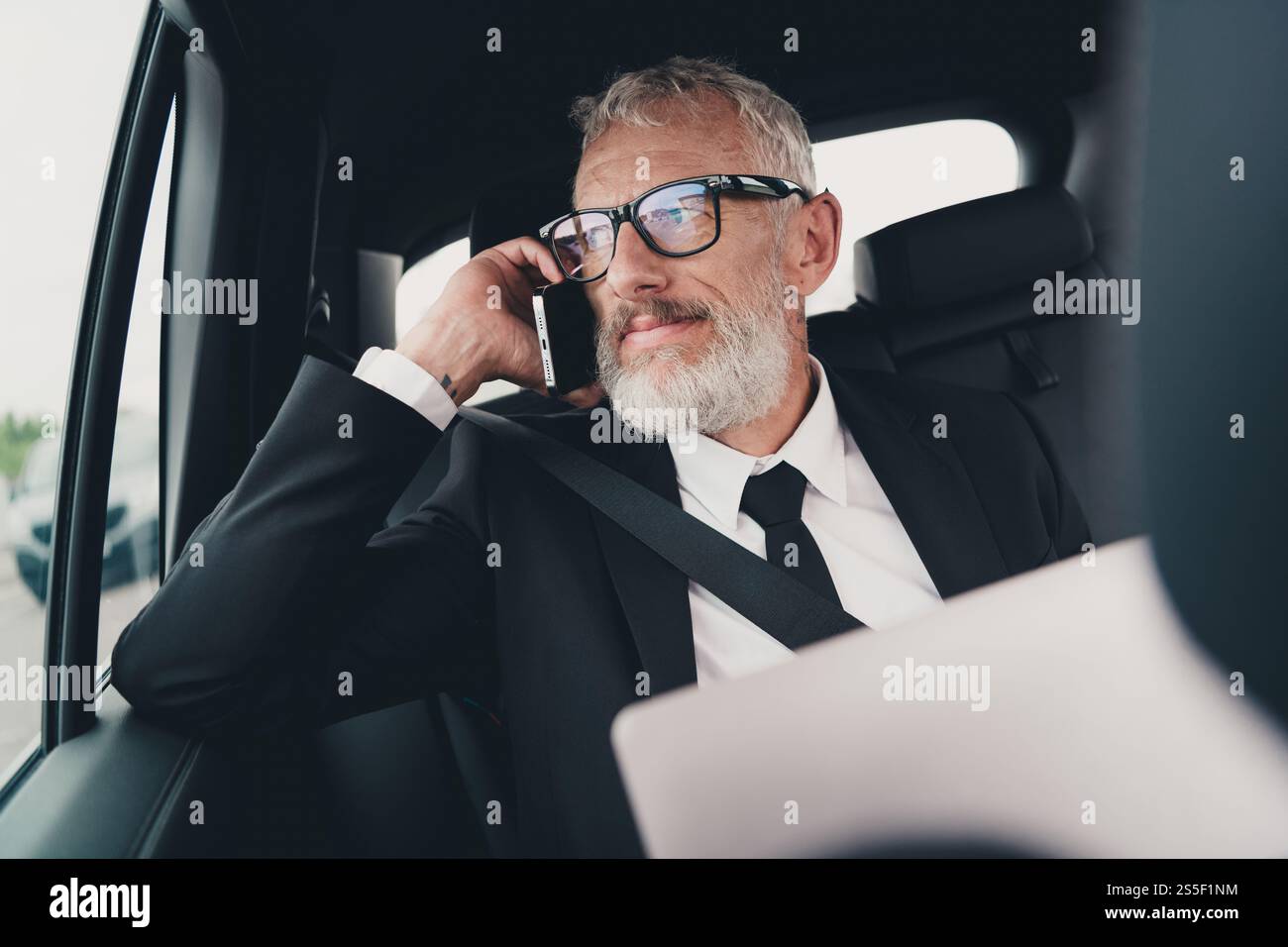 Handsome businessman glasses driving talking hi-res stock photography ...