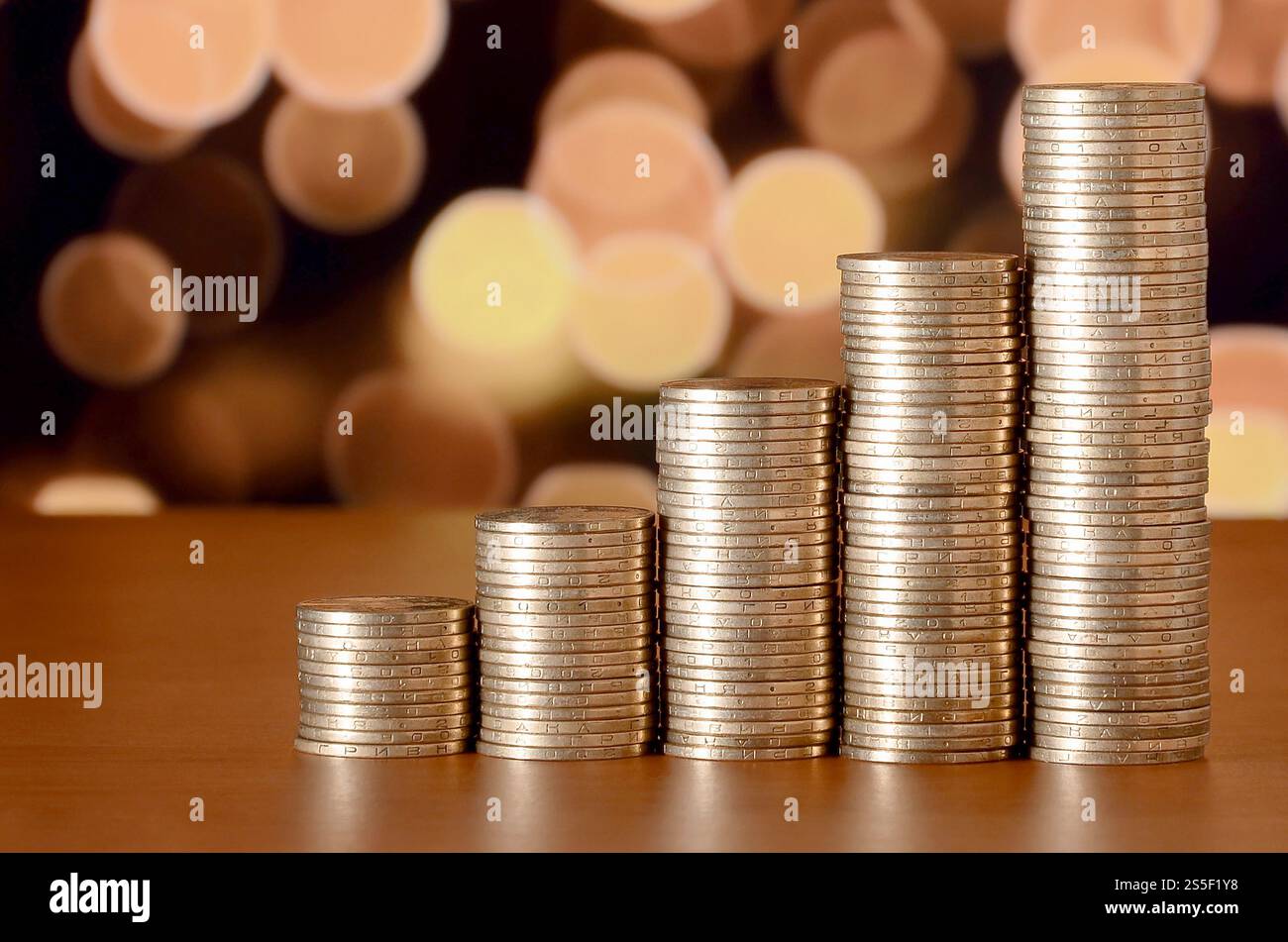 Golden coin stacks arranged as a graph. Increasing columns of coins ...