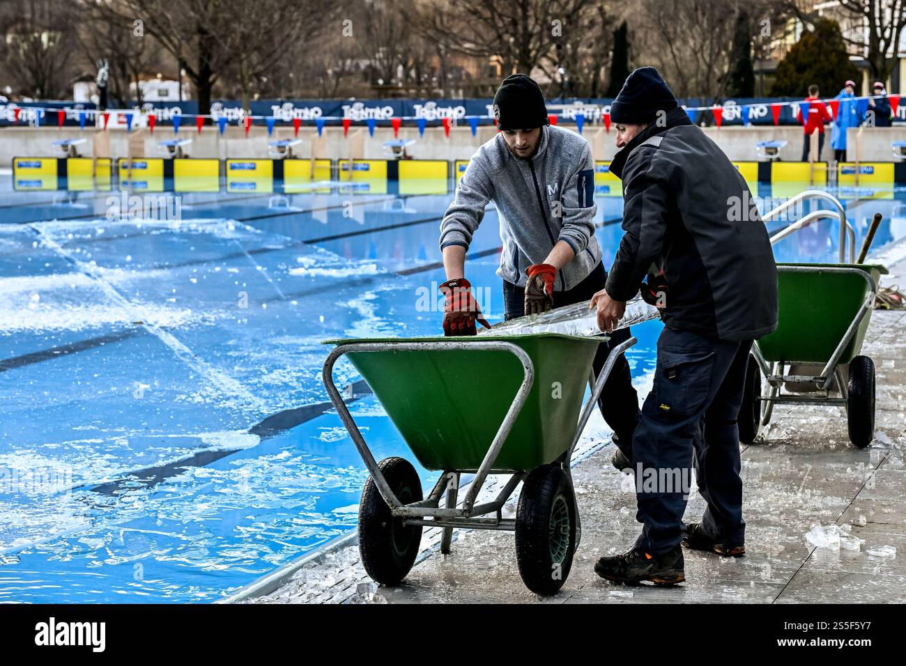 Staff removes ice from the pool hi-res stock photography and images - Alamy