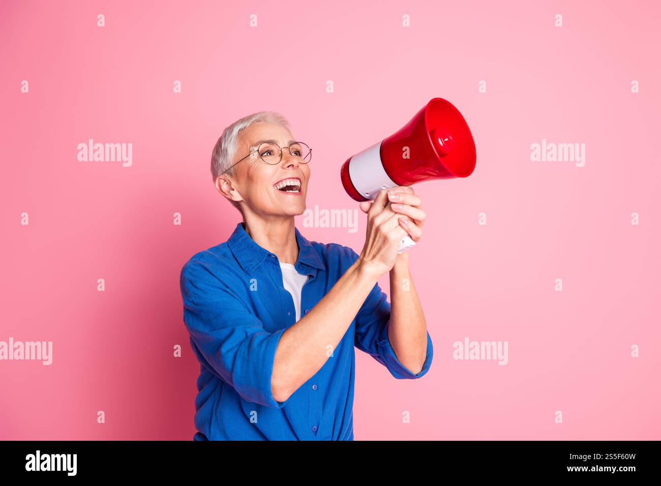 Photo of adorable good mood woman wear blue shirt screaming toa empty ...
