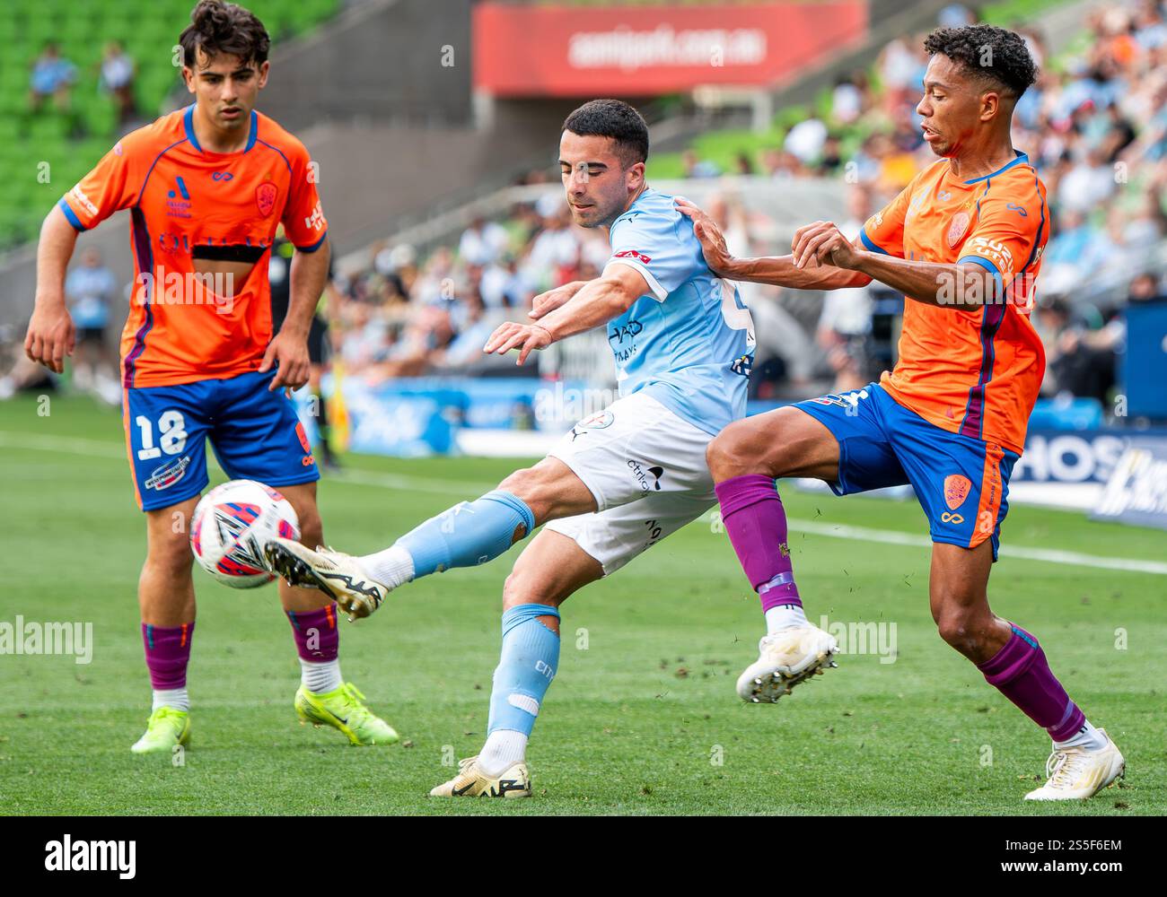 Melbourne City's Ben Mazzeo (Center), Brisbane Roar's Jacob Brazete (L ...