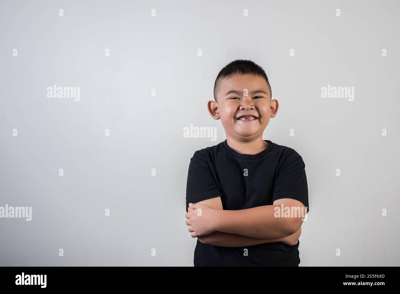 Portrait of boy thinking something in studio photo Stock Photo - Alamy