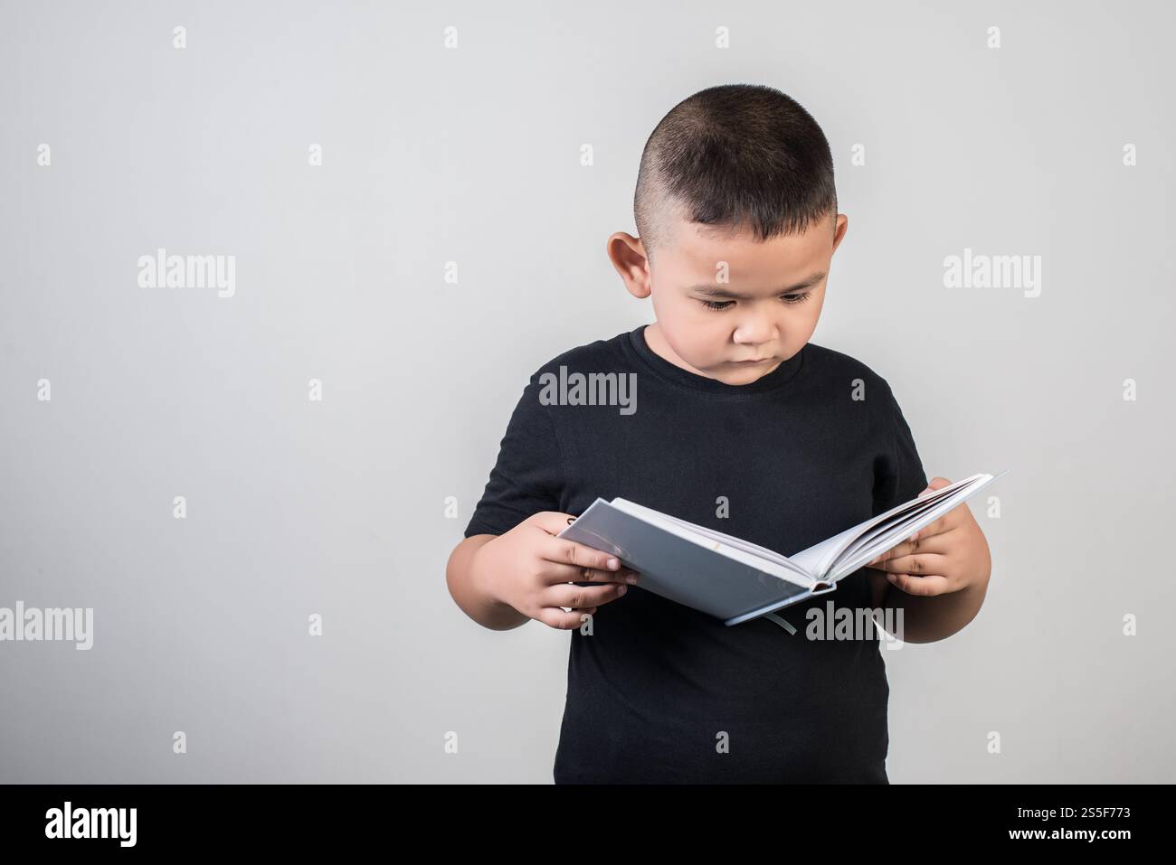 Funny boy reading a book Stock Photo - Alamy