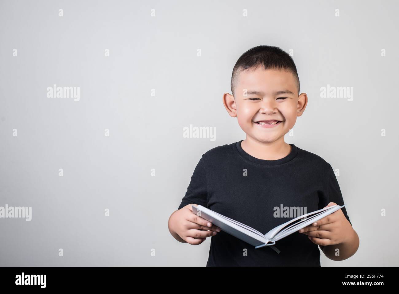 Funny boy reading a book Stock Photo - Alamy