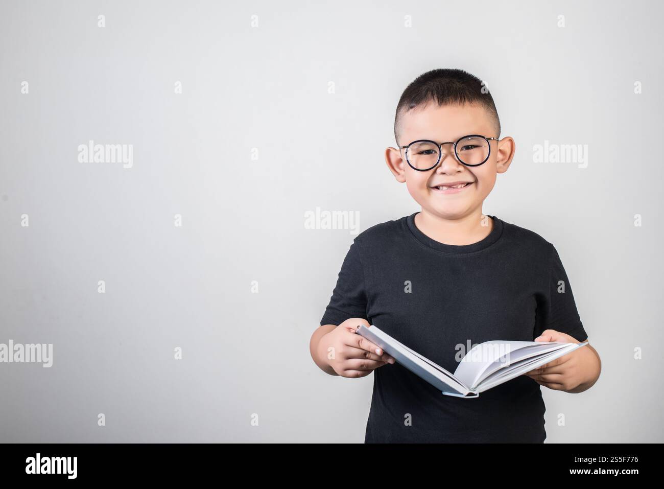 Funny boy reading a book Stock Photo - Alamy