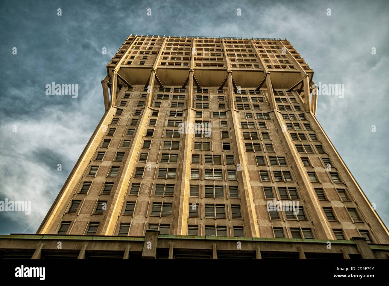 Upward view of a tall Torre Velasca tower in Brutalist style building ...
