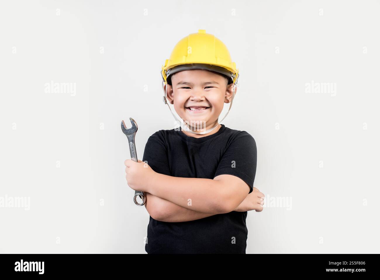Portrait Happy boy wearing engineer hat Stock Photo - Alamy
