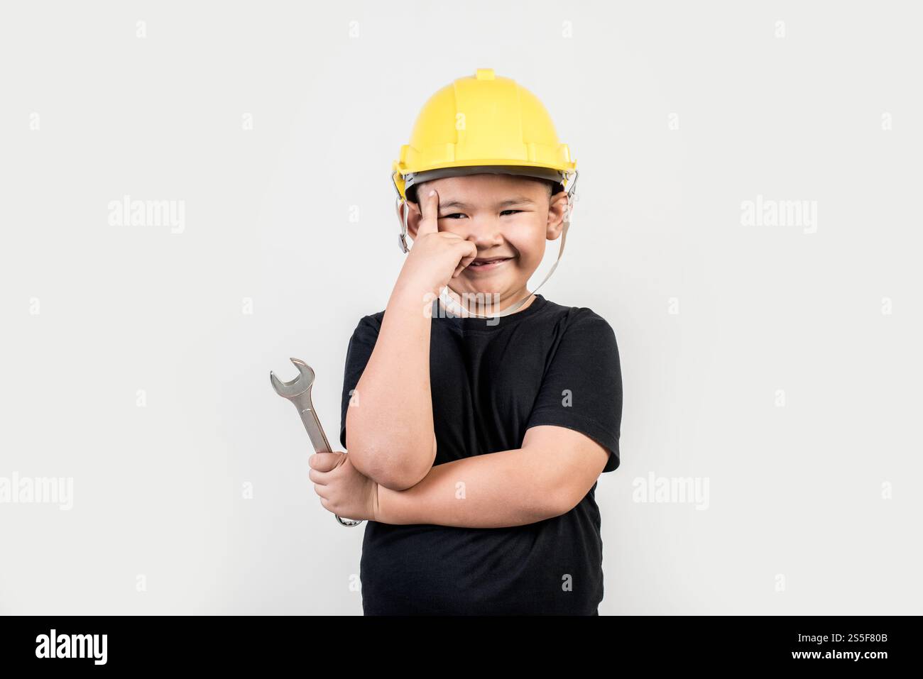 Portrait Happy boy wearing engineer hat Stock Photo - Alamy