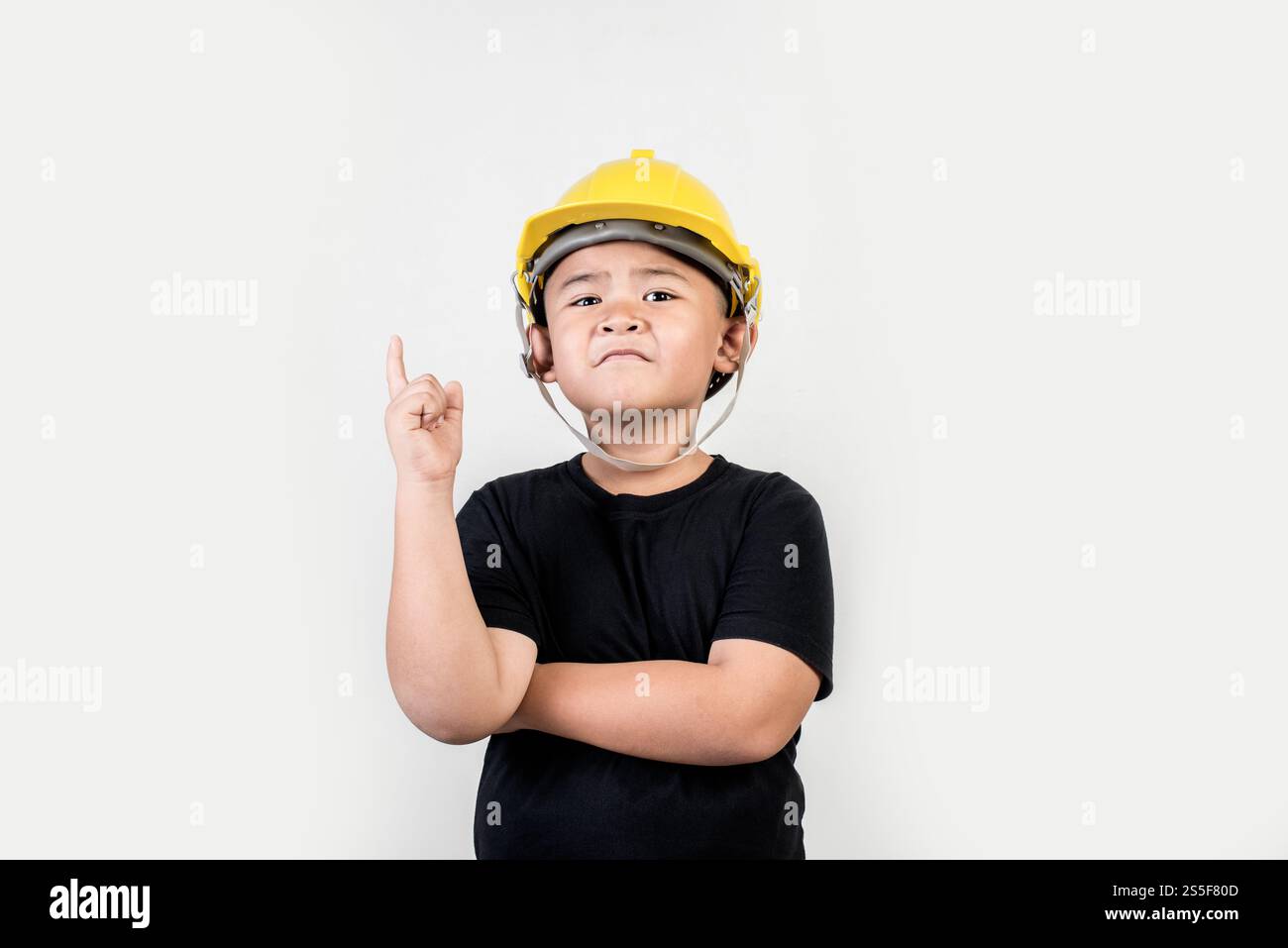 Portrait Happy boy wearing engineer hat Stock Photo - Alamy