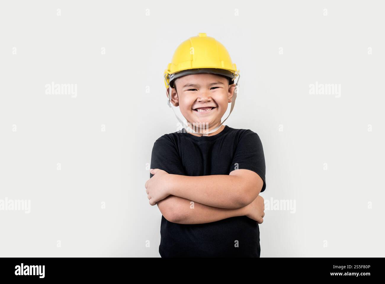 Portrait Happy boy wearing engineer hat Stock Photo - Alamy