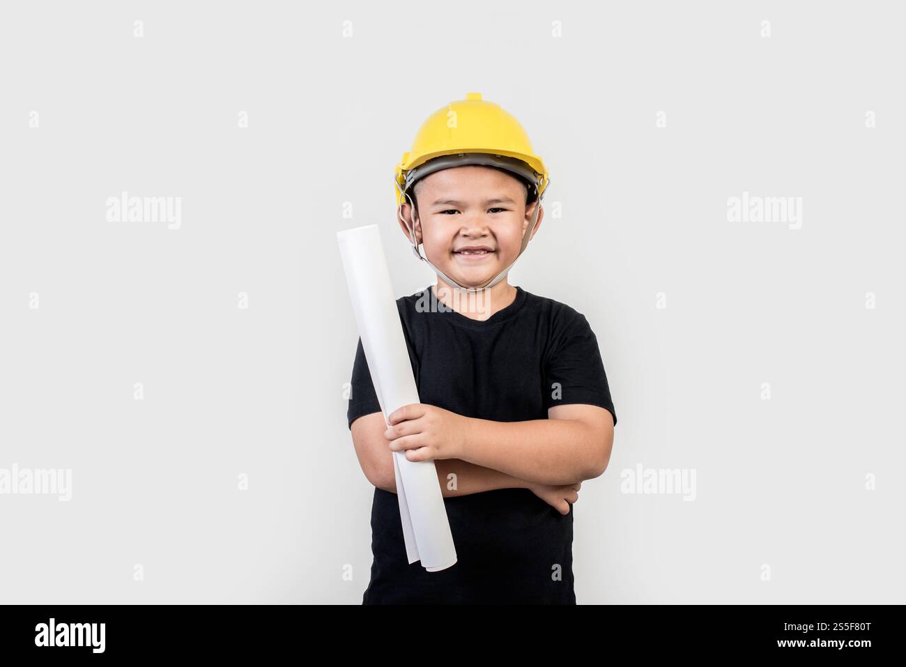 Portrait Happy boy wearing engineer hat Stock Photo - Alamy