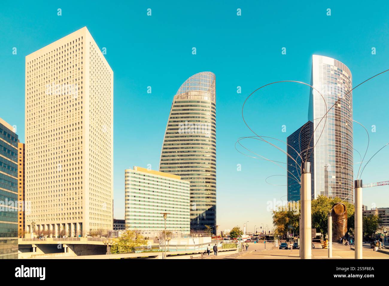 Modern cityscape of La Defense with skyscrapers and artistic sculptures ...