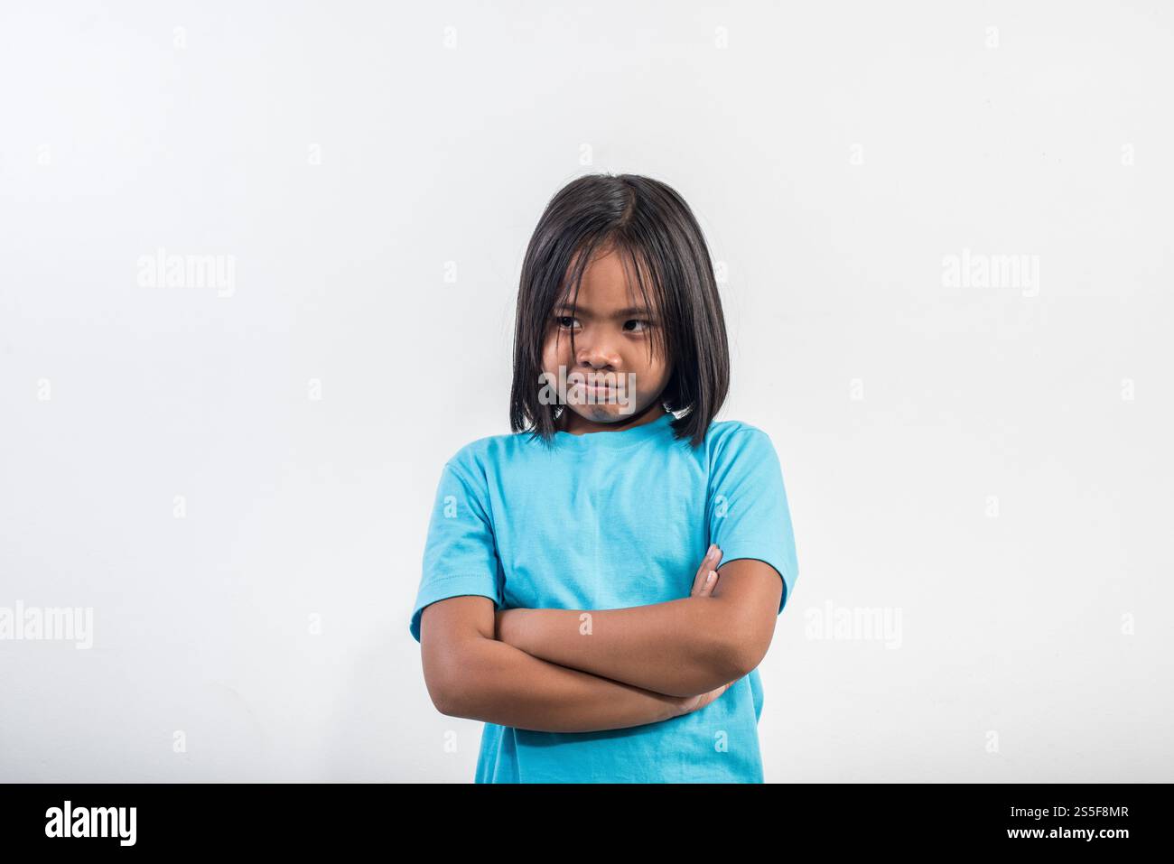 little girl feel angry in studio shot Stock Photo - Alamy