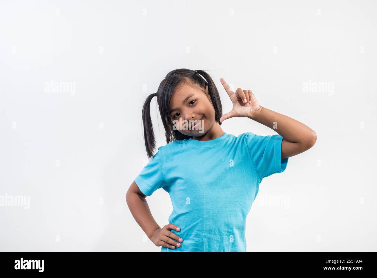 Portrait of Funny little girl acting in studio shot Stock Photo - Alamy