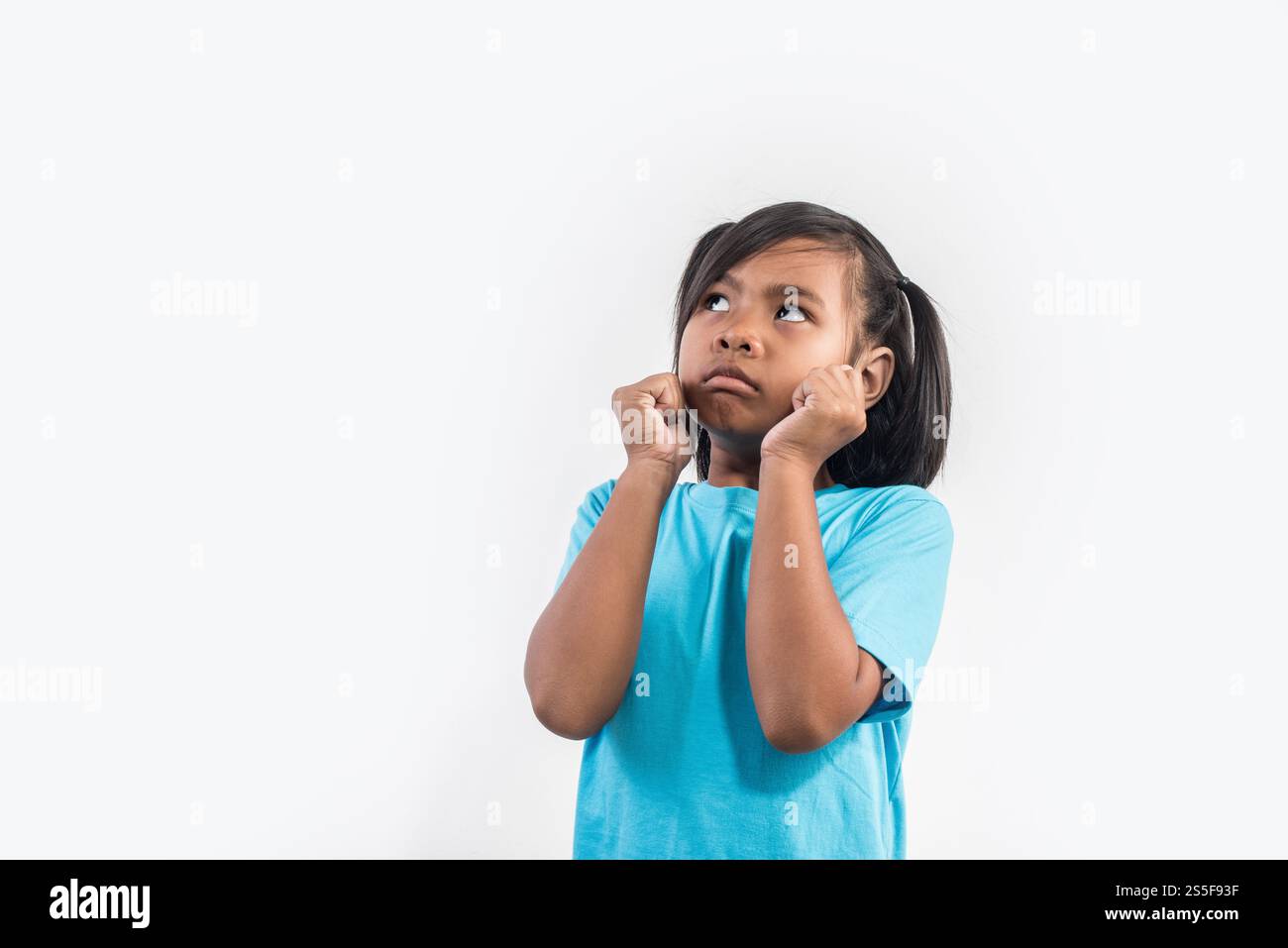 little girl feel angry in studio shot Stock Photo - Alamy
