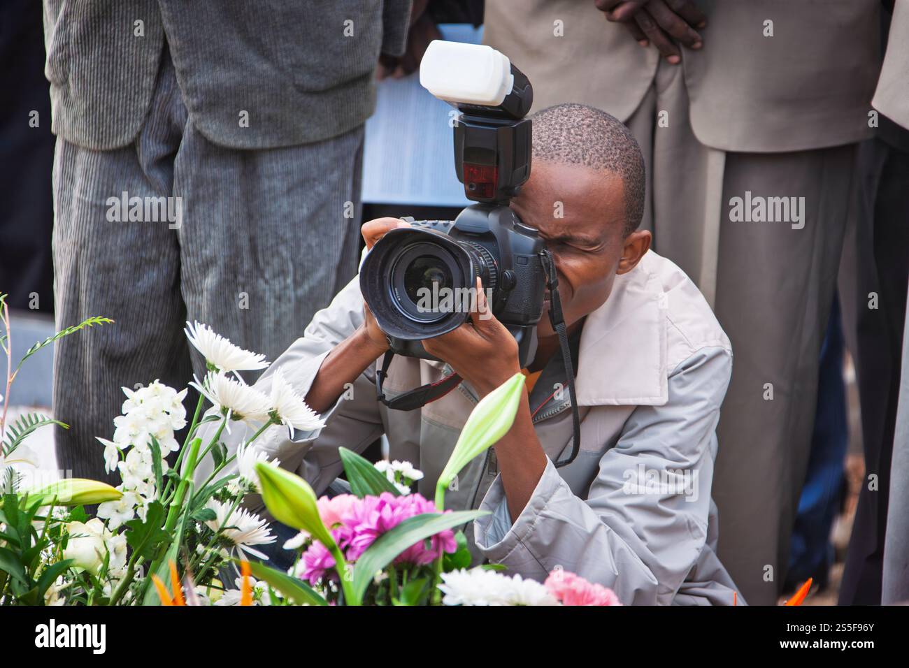african photographer taking pictures at a funeral catholic Stock Photo ...