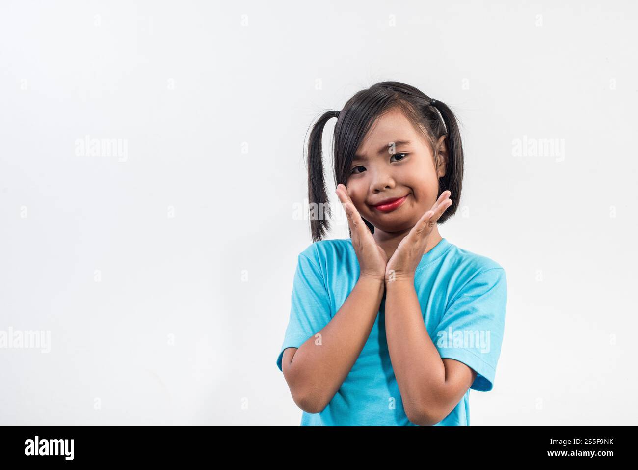 Portrait of Funny little girl acting in studio shot Stock Photo - Alamy