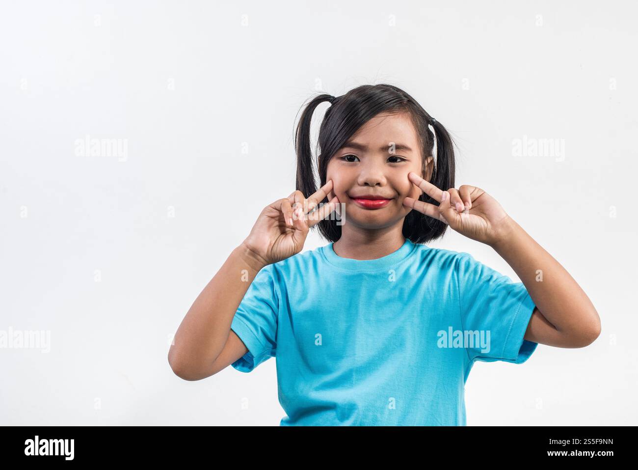 Portrait of Funny little girl acting in studio shot Stock Photo - Alamy