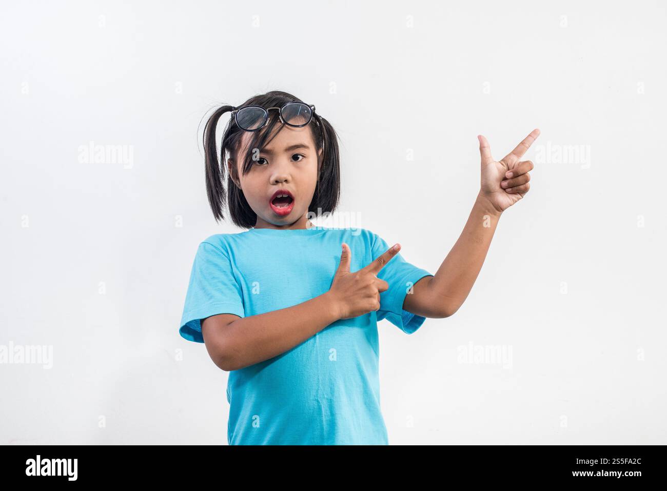 Portrait of Funny little girl acting in studio shot Stock Photo - Alamy