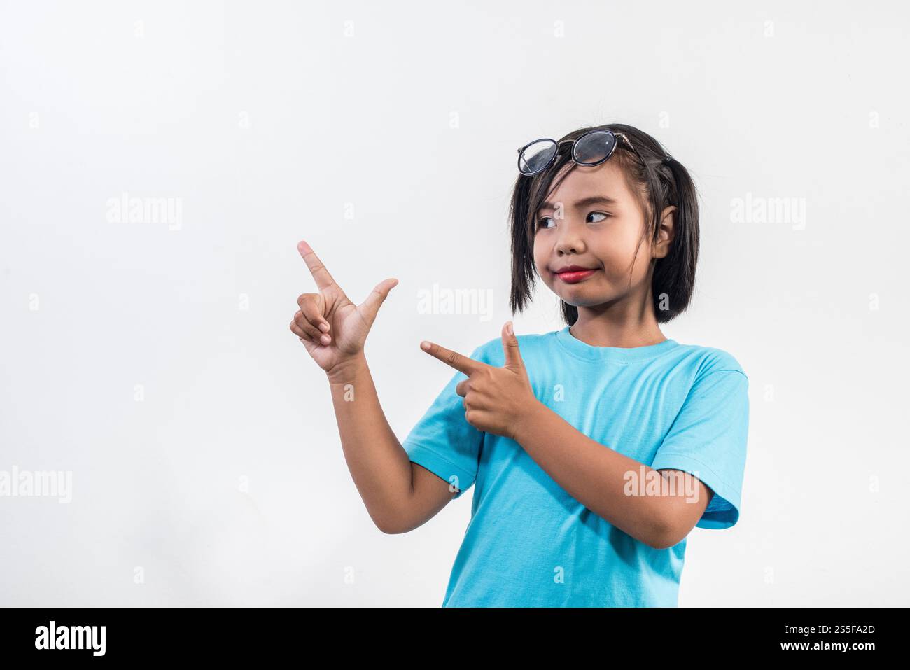 Portrait of Funny little girl acting in studio shot Stock Photo - Alamy