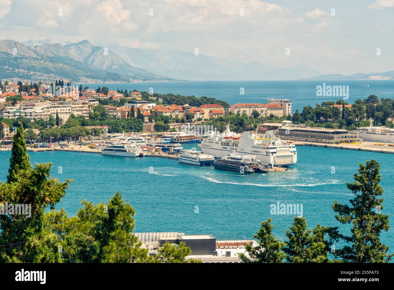 Coastal town of Split with a marina under clear skies, featuring moored ...