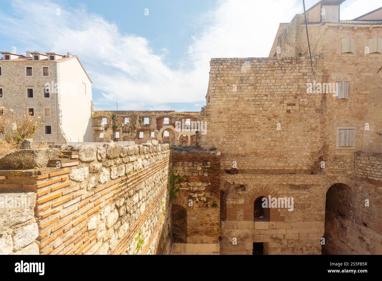 Ancient stone walls and arches of a historic ruin of Vomitorium under a ...