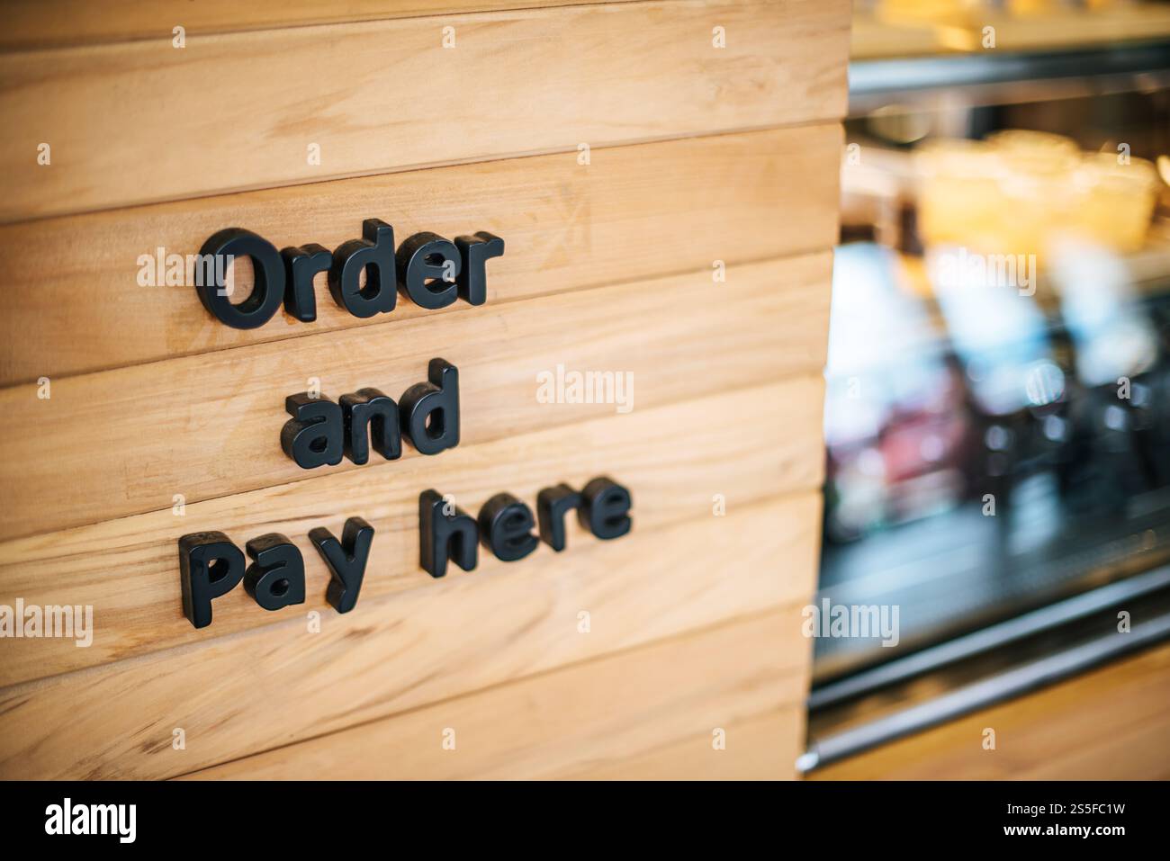 Front counter coffe shop cafe Order and pay here Stock Photo - Alamy