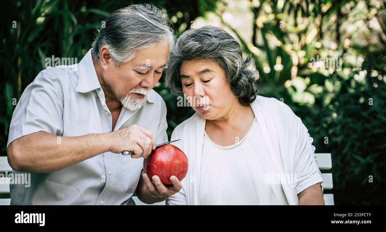 Elderly Couples Playing and eating some fruit Stock Photo - Alamy