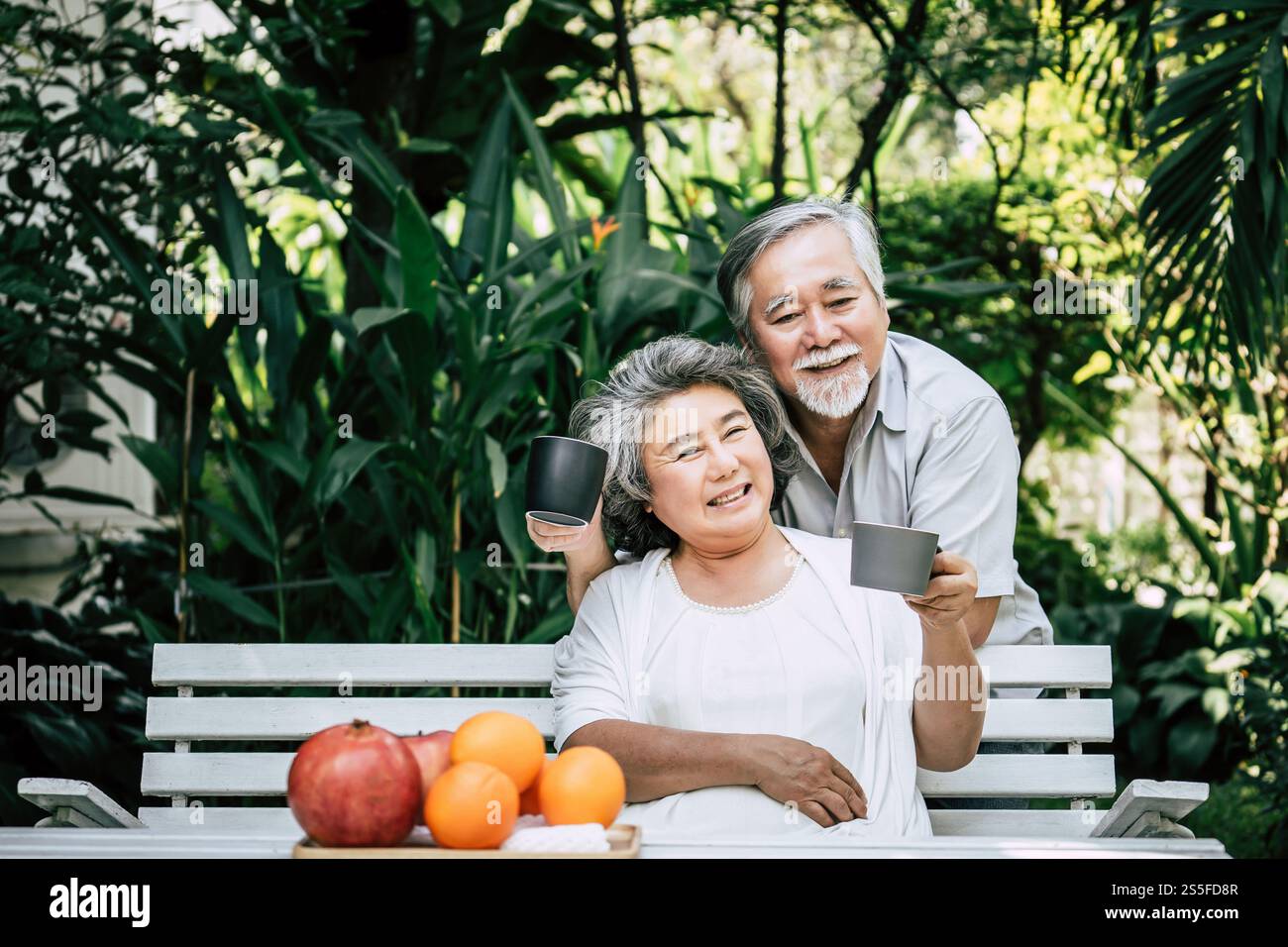 Elderly Couples Playing and eating some fruit Stock Photo - Alamy
