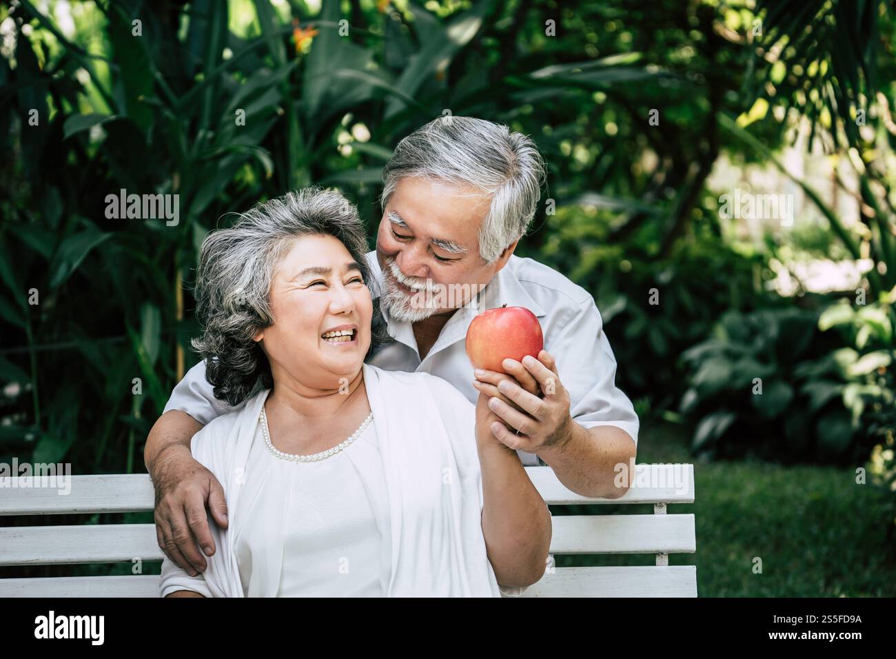 Elderly Couples Playing and eating some fruit Stock Photo - Alamy