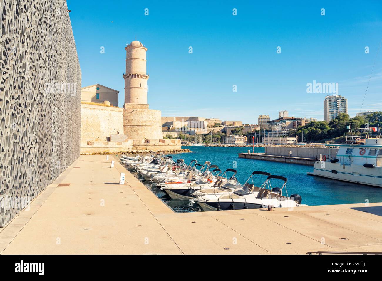 Sunny day view of a historic port of Marseille marina with boats docked ...