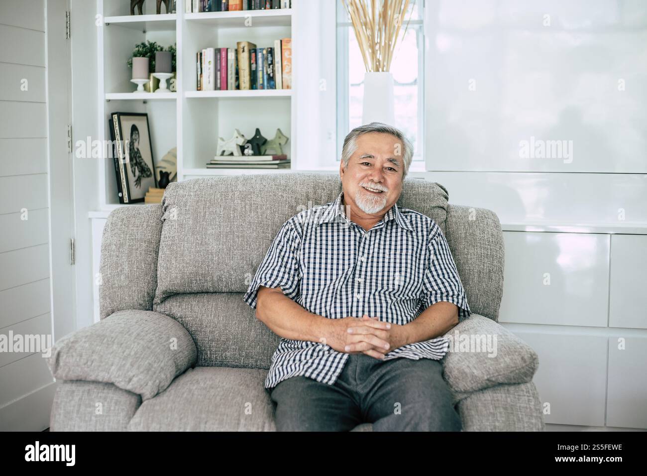 Senior adult man sitting hi-res stock photography and images - Alamy