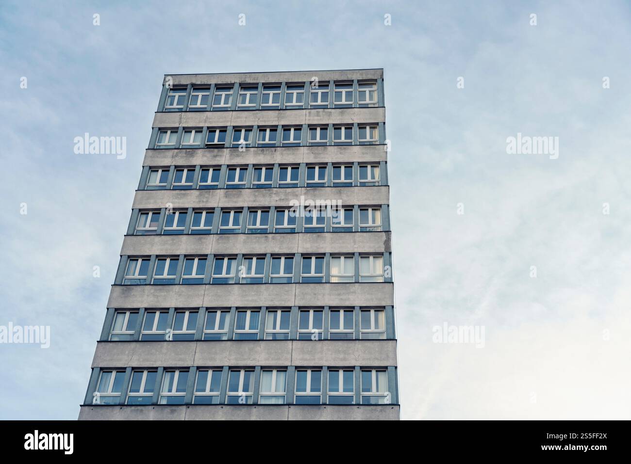 Modern concrete building repetitive windows cloudy sky hi-res stock ...