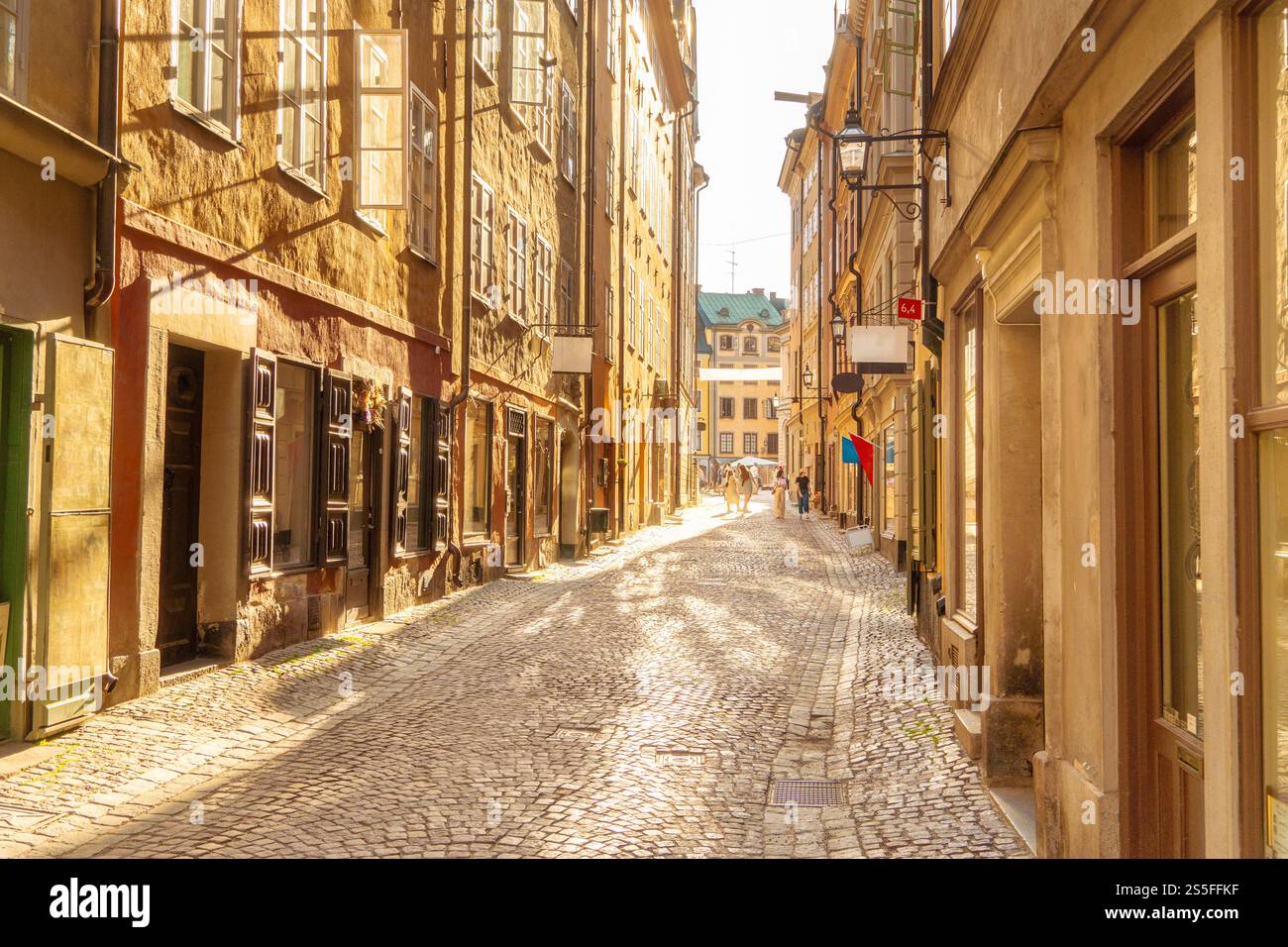 Sunlight bathes old cobblestone street gamlstan lined historic ...