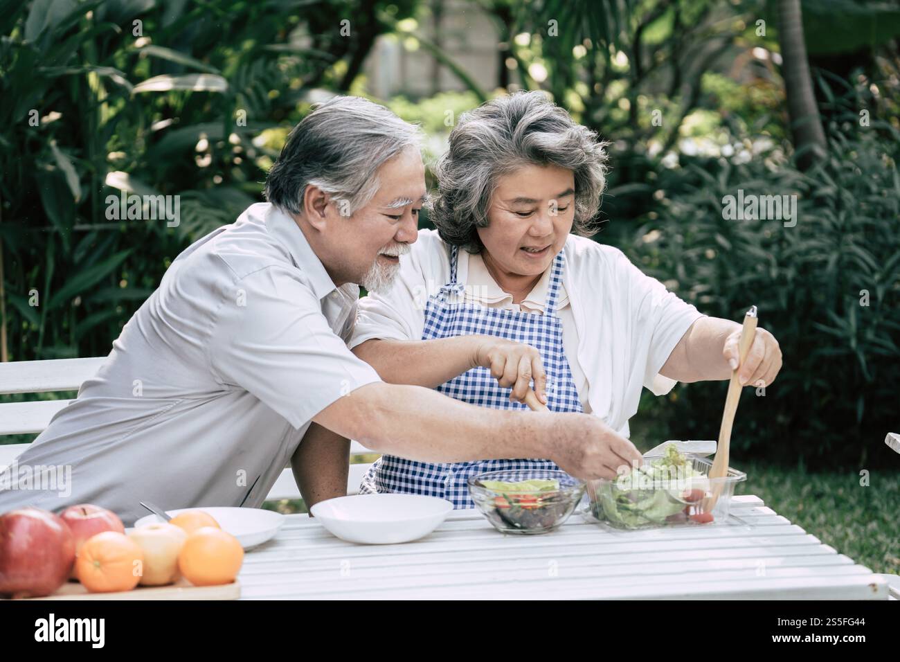 Elderly couples Cooking Healthy food together Stock Photo - Alamy
