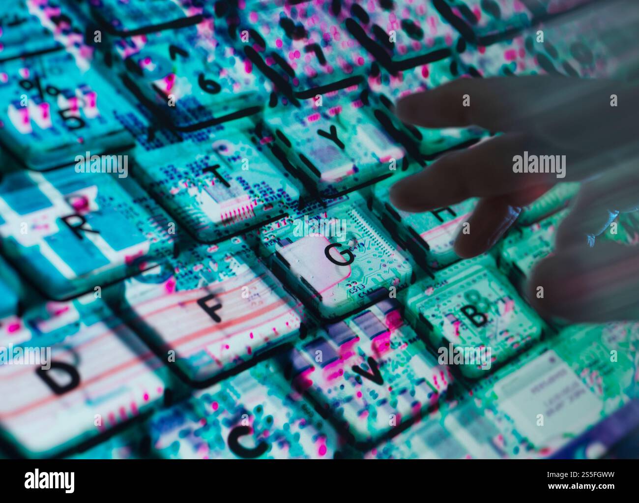 Hands typing at laptop with the computer hardware revealed underneath ...