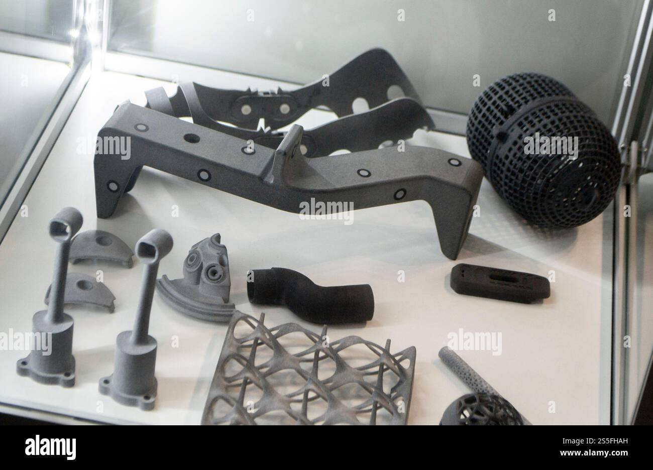 Models printed on 3D printer from grey polyamide powder close-up ...