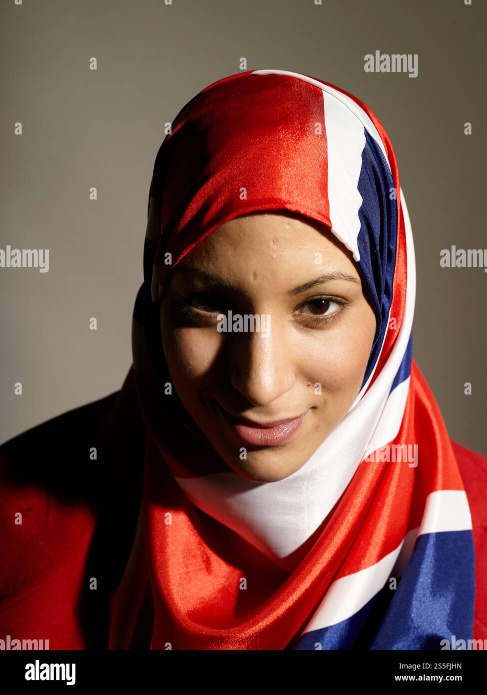 Woman with a smile wearing a hijab styled with the colors of the ...