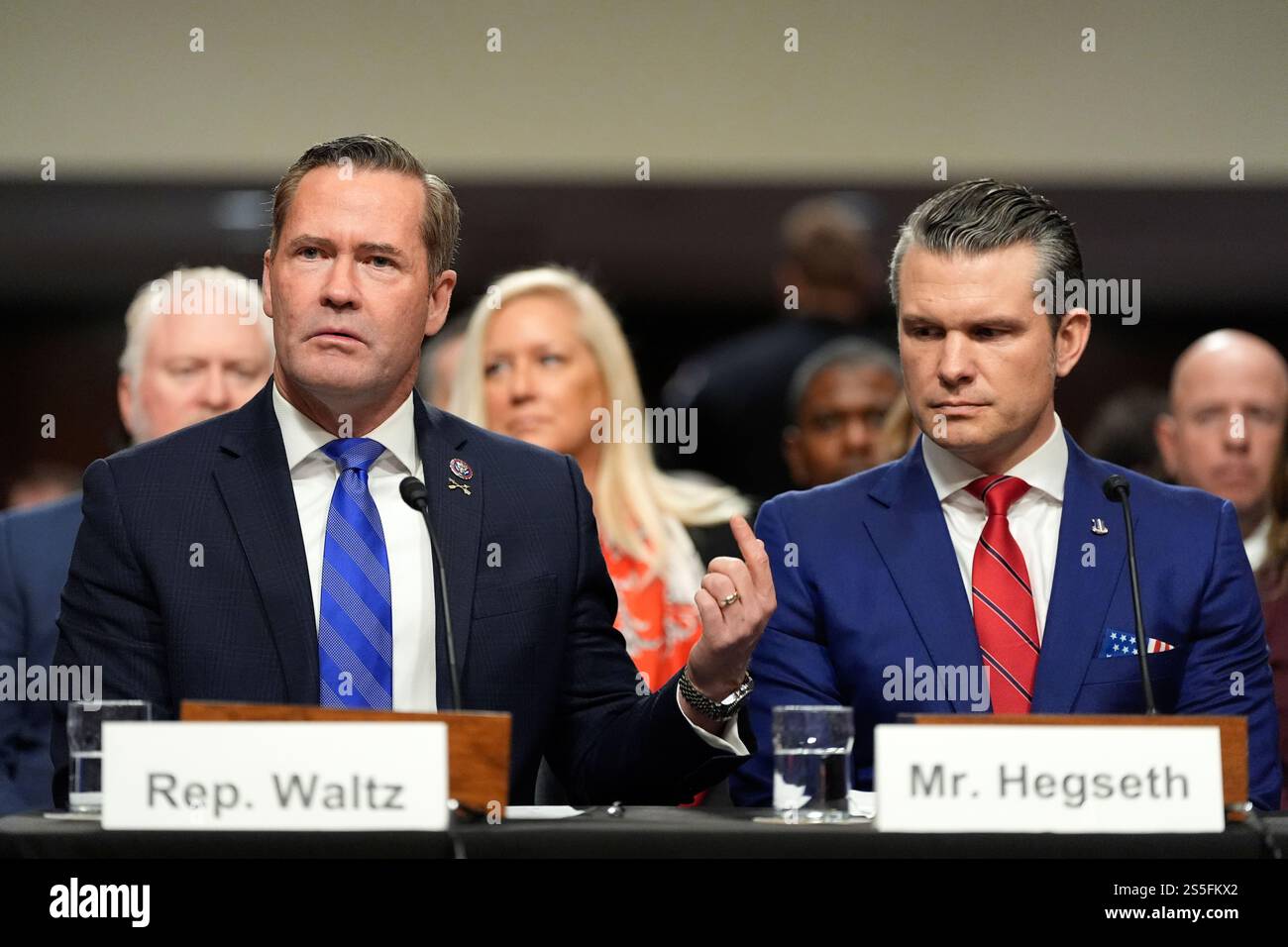 Rep. Michael Waltz, R-Fla., left, speaks about Pete Hegseth, right ...